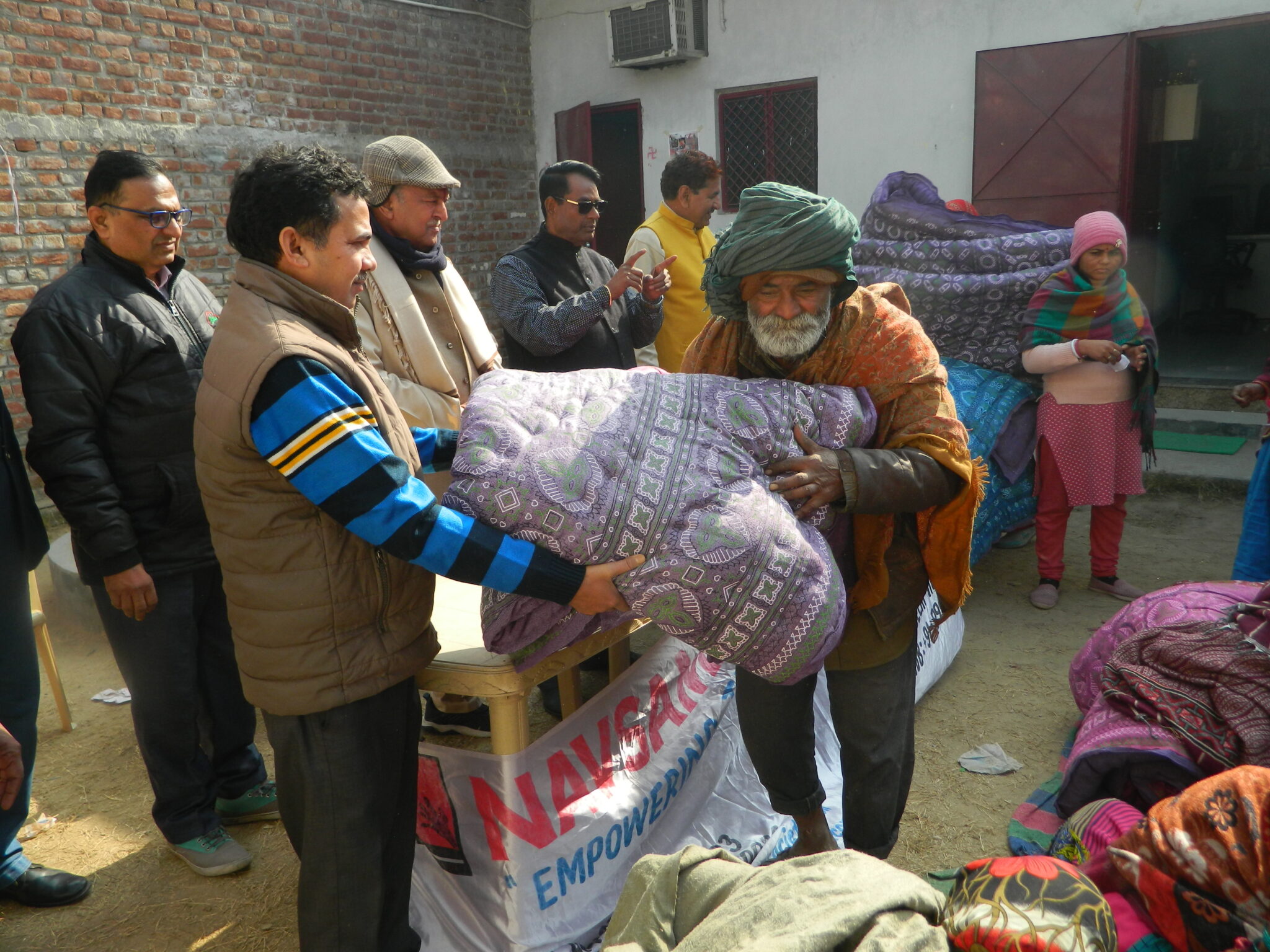 QUILT DISTRIBUTION AMONG UNDERPRIVILEGED PEOPLE AT SLUM AREA RAJOKARI ...